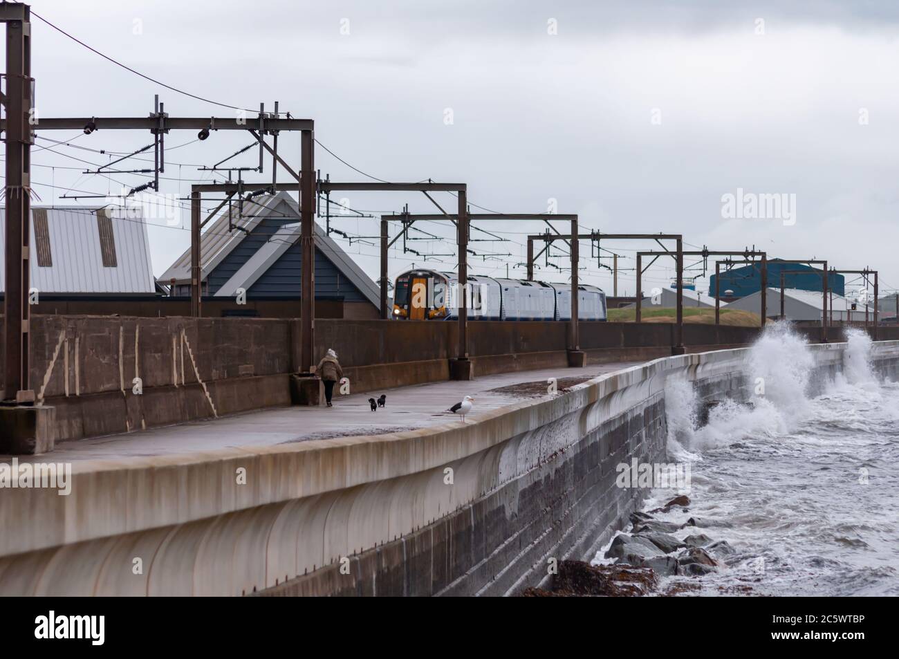 Saltcoats, Scotland, UK. 5th July 2020. UK Weather: A train passing ...