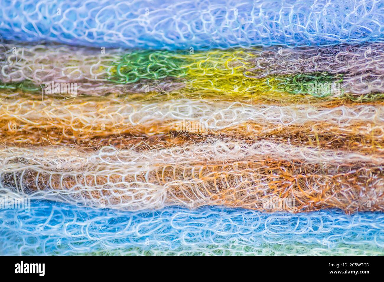 pile of knitted colorful shawls for background Stock Photo - Alamy