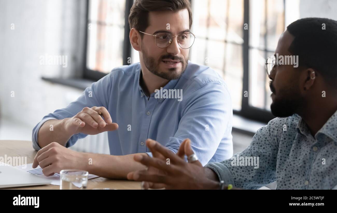 Multiracial representative and client planning future collaboration ...