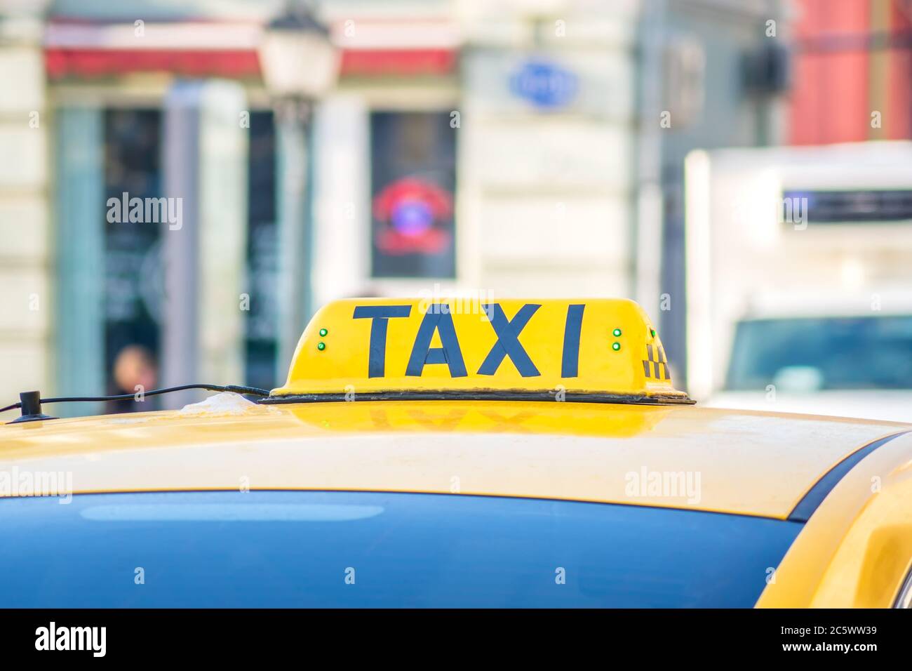 Yellow taxi sign. Taxi car on the street Stock Photo - Alamy