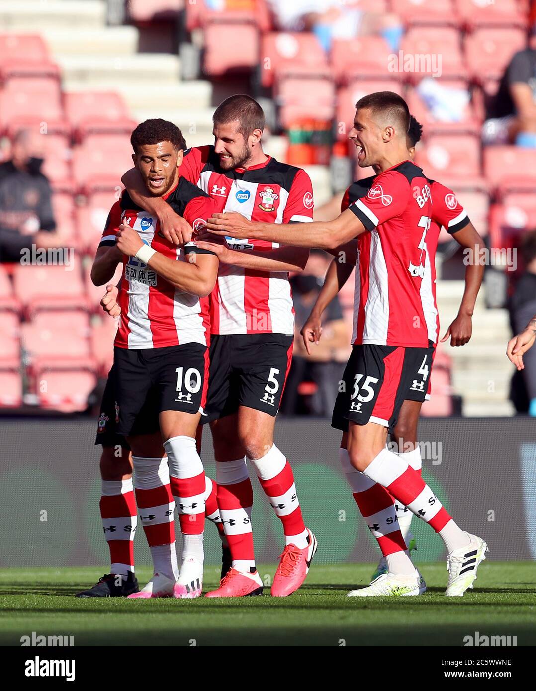 Southampton's Che Adams (left) celebrates scoring his side's first goal ...