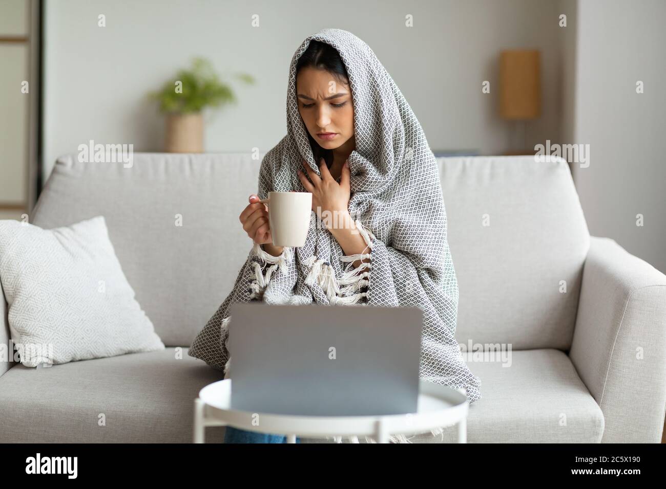 Sick Girl Drinking Tea Sitting At Laptop Working From Home Stock Photo ...