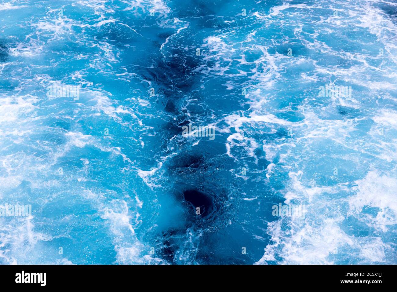 Speedboat tail on sea water photo. White foam on blue water. Ocean ...