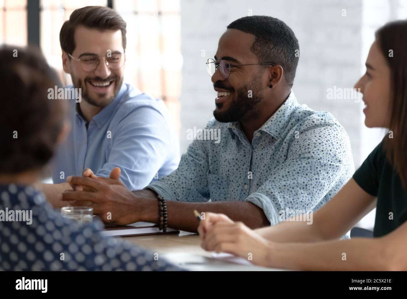 Happy african corporate teacher and staff positive interaction at ...