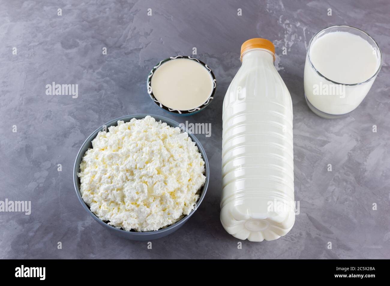 Various dairy products. Healthy dairy products on a gray background ...