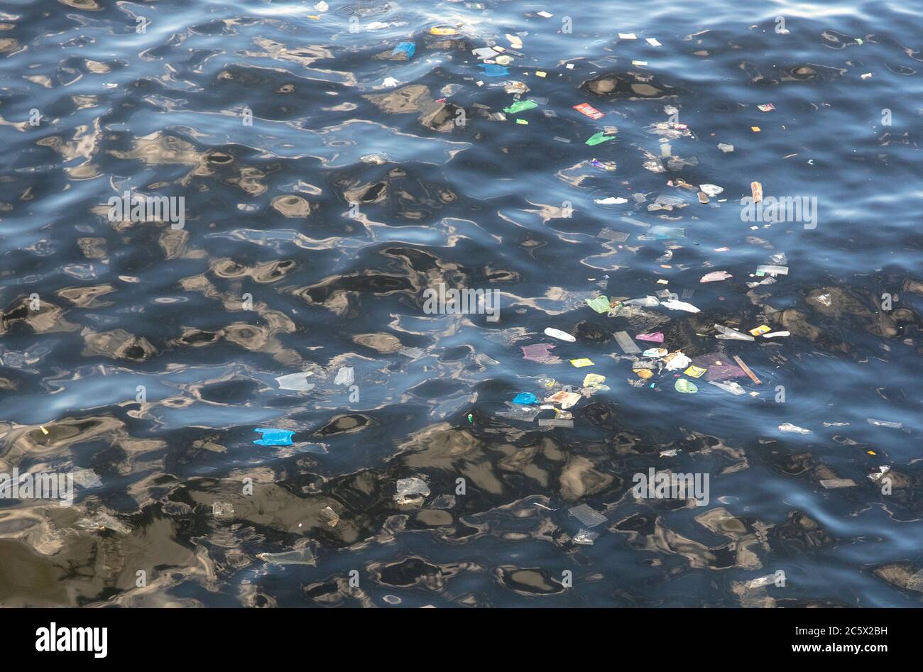 Trash in sea water. Plastic bags in ocean. Ecological problem. Urban ...