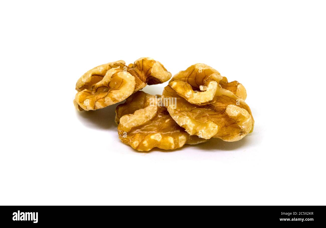 Natural walnut on white background. Cracked and cleaned nut seeds ...