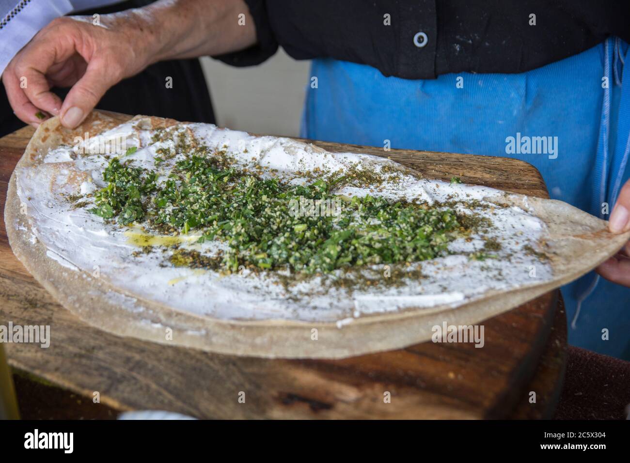 Traditional Druze Pita bread, baked on a metal Saj or Tava, with ...