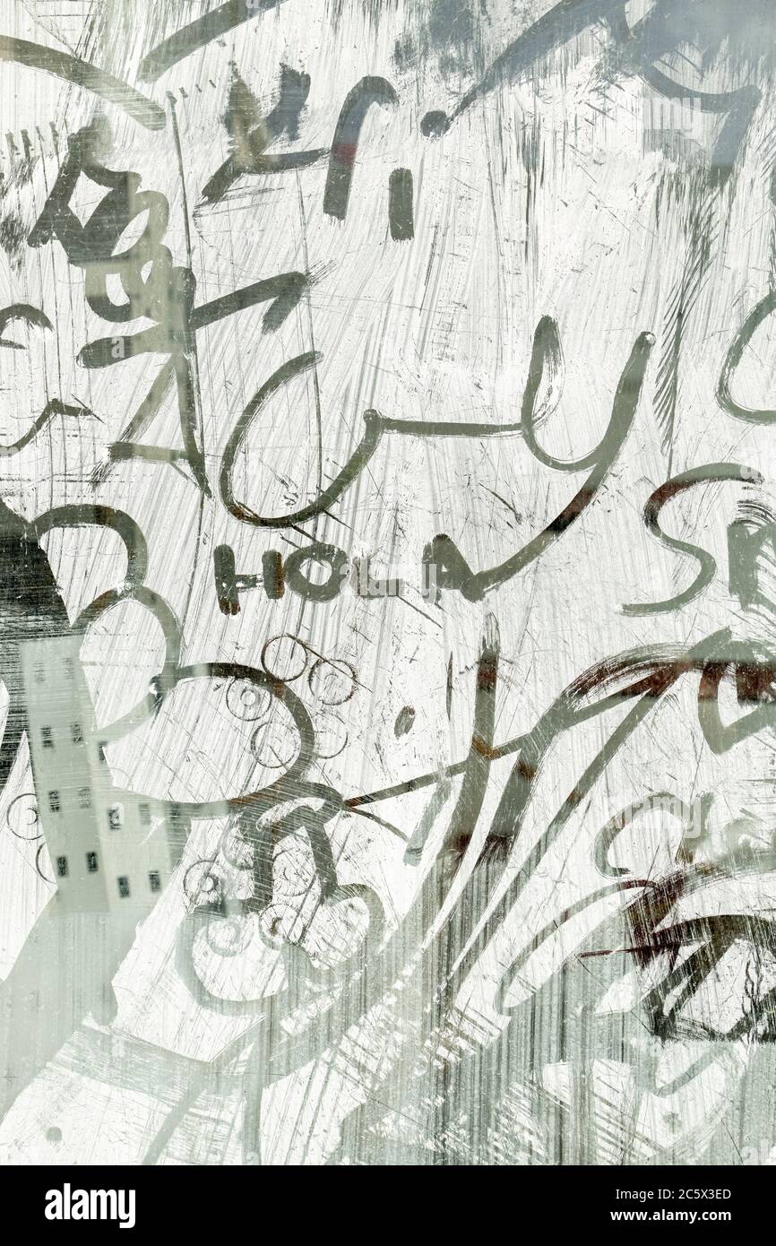 Drawings and writings on window whitewash paint creates an abstract ...