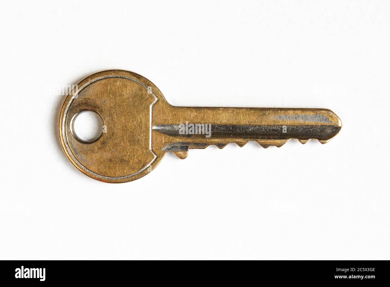 Old safety key isolated on white background. Used and damaged metal ...
