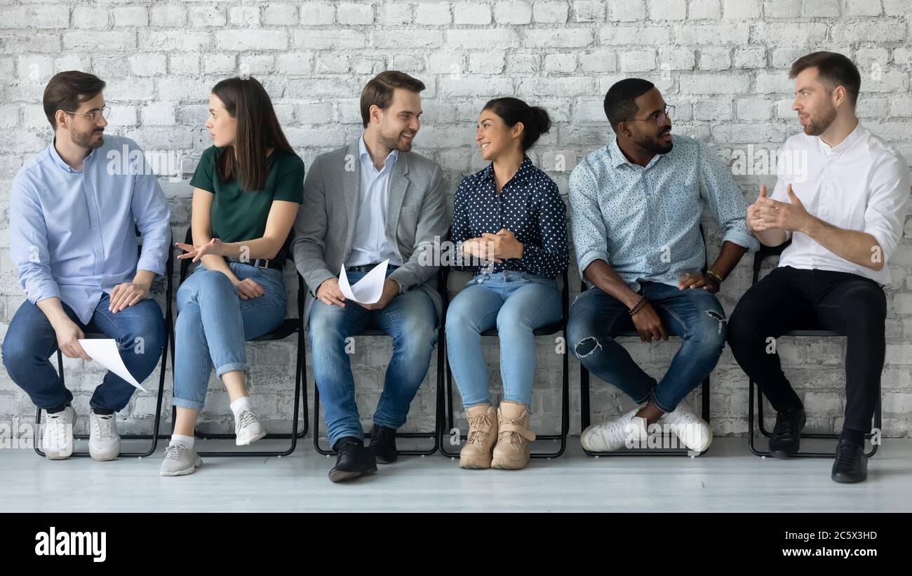 Group of multi ethnic people talking gathered in office corridor Stock ...