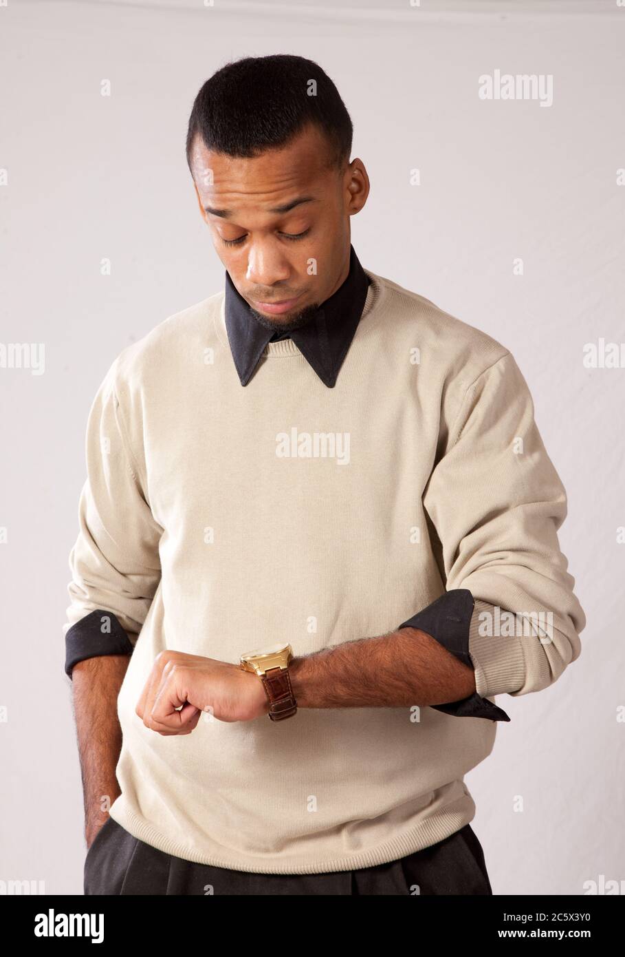 Handsome man checking his watch Stock Photo - Alamy