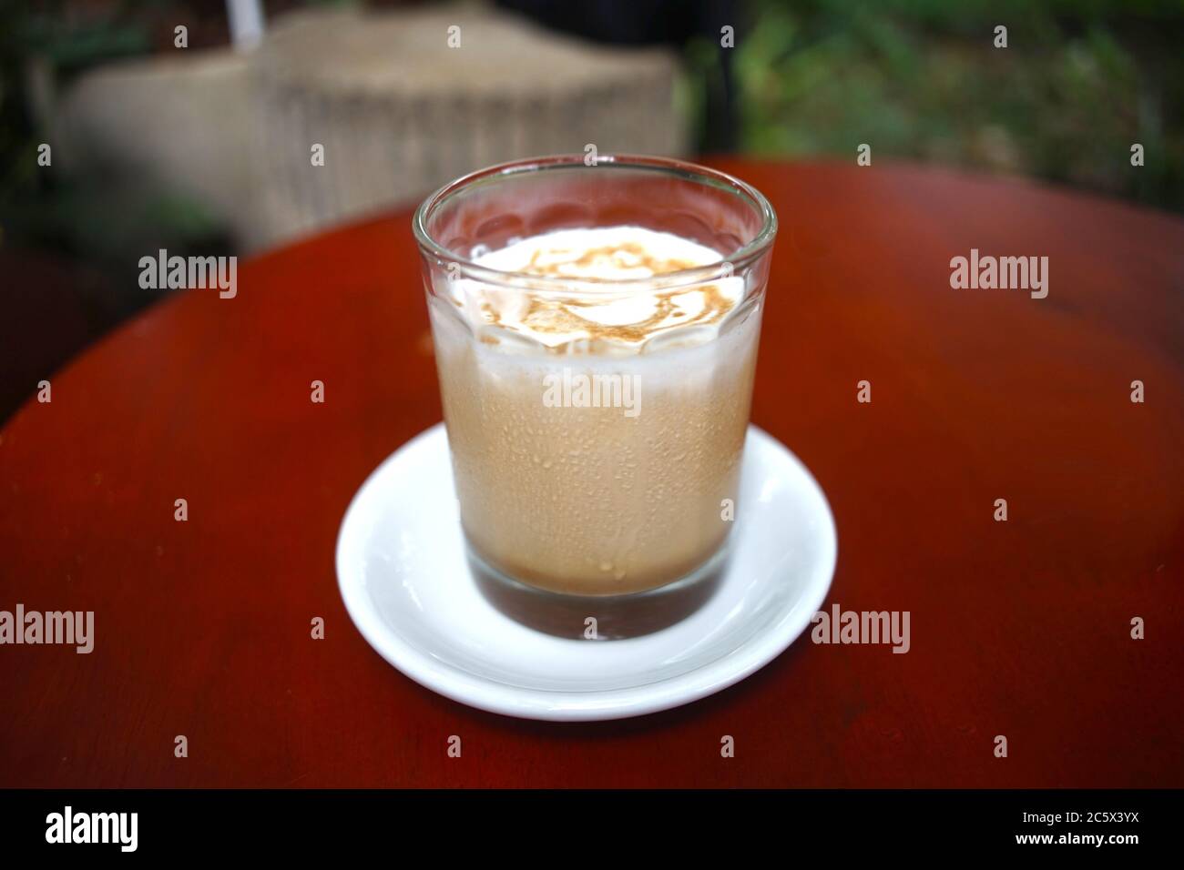 Iced Latte coffee in a grass Stock Photo - Alamy