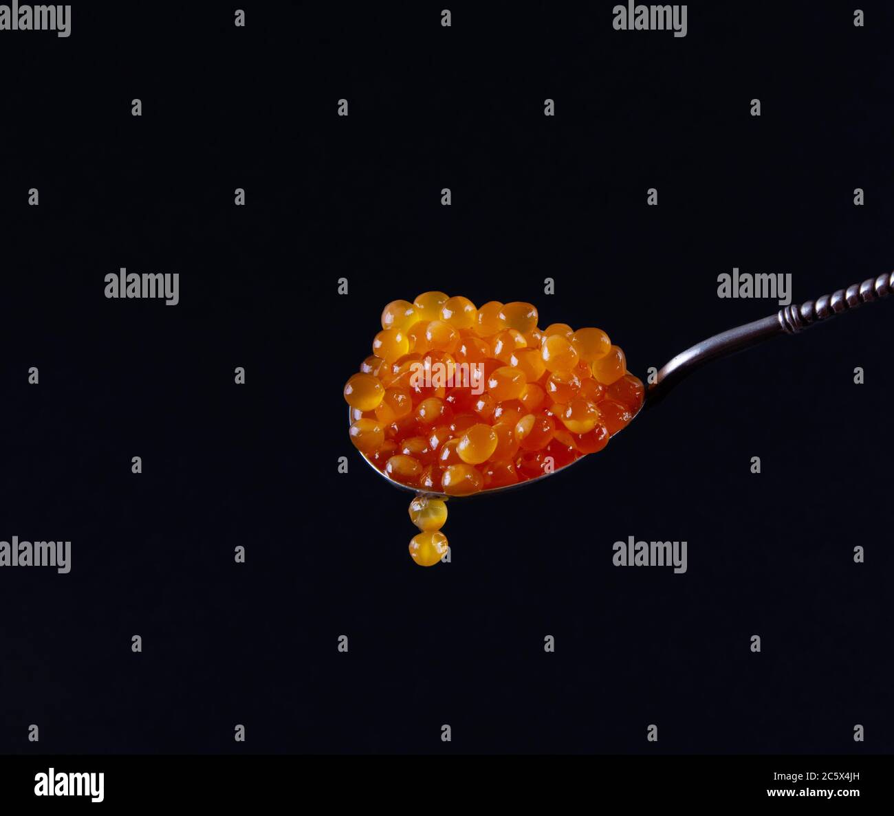 Salmon Roe in Silver Spoon on Dark Background Stock Photo - Alamy