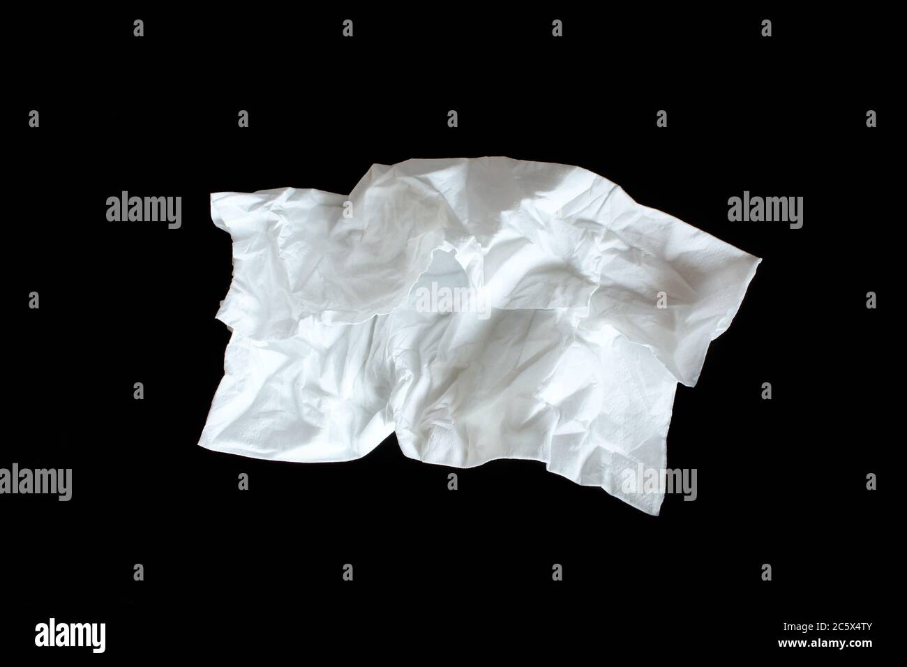 Used paper napkin isolated on black background. Crumpled tissue Stock ...