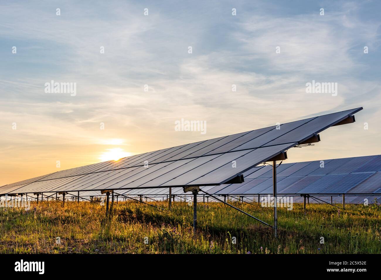 ground mounted photovoltaic power station at sunset Stock Photo - Alamy