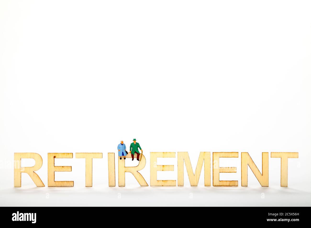 Wooden retirement sign with elderly miniature figure people and copy ...