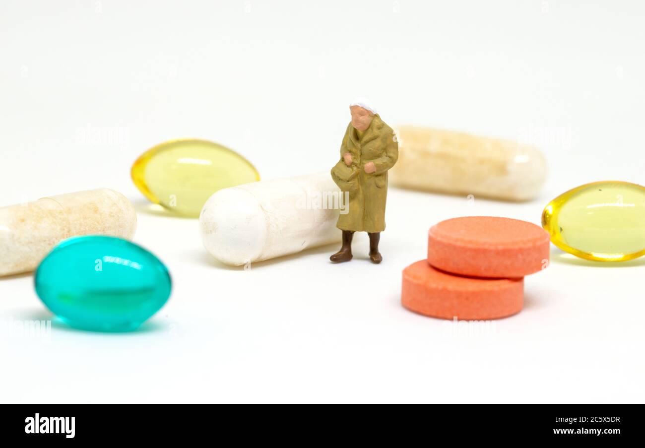 Old woman and pill bunch on white background. Medical prescription and ...