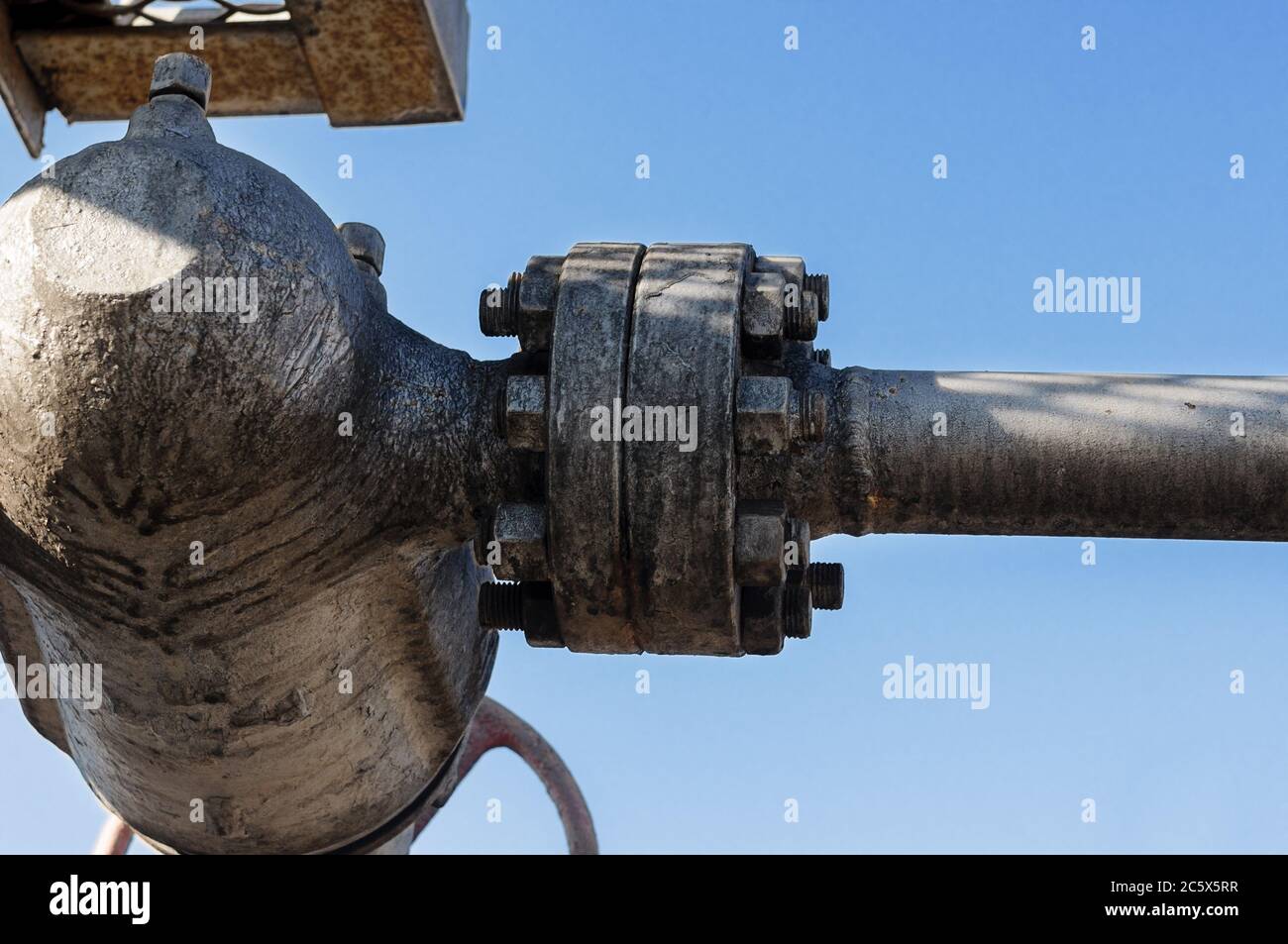 Gate valve at the mouth of a gas well. Flange connection with unevenly ...