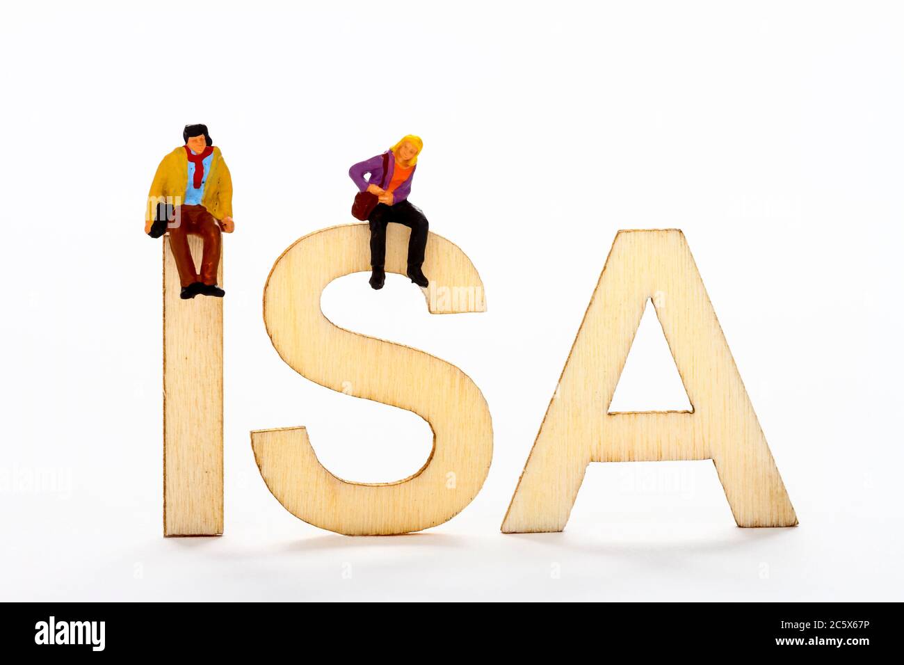 Miniature figure couple sat on wooden ISA letters individual tax free ...