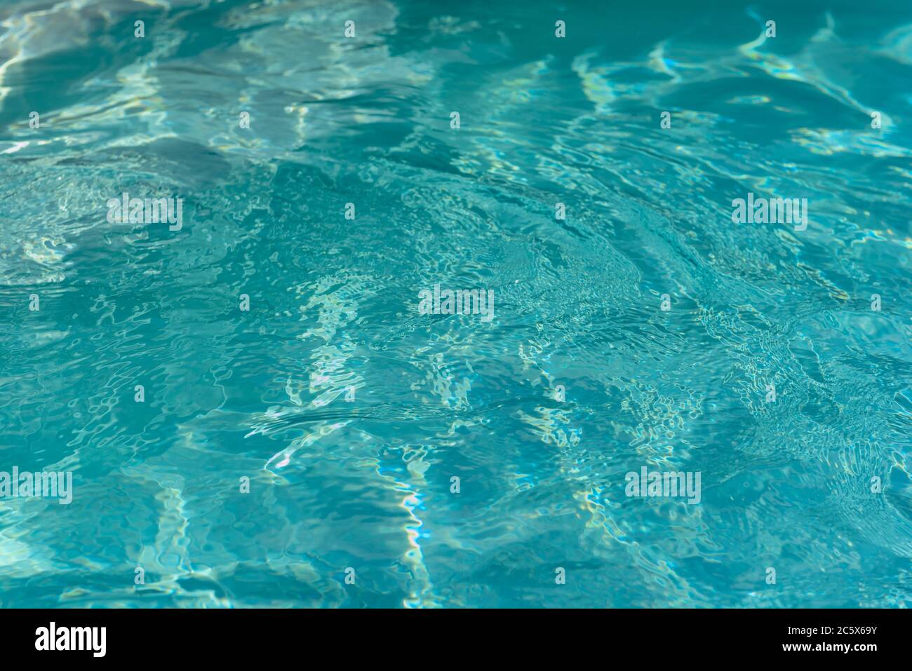 Private pool with clear water in summertime Stock Photo - Alamy
