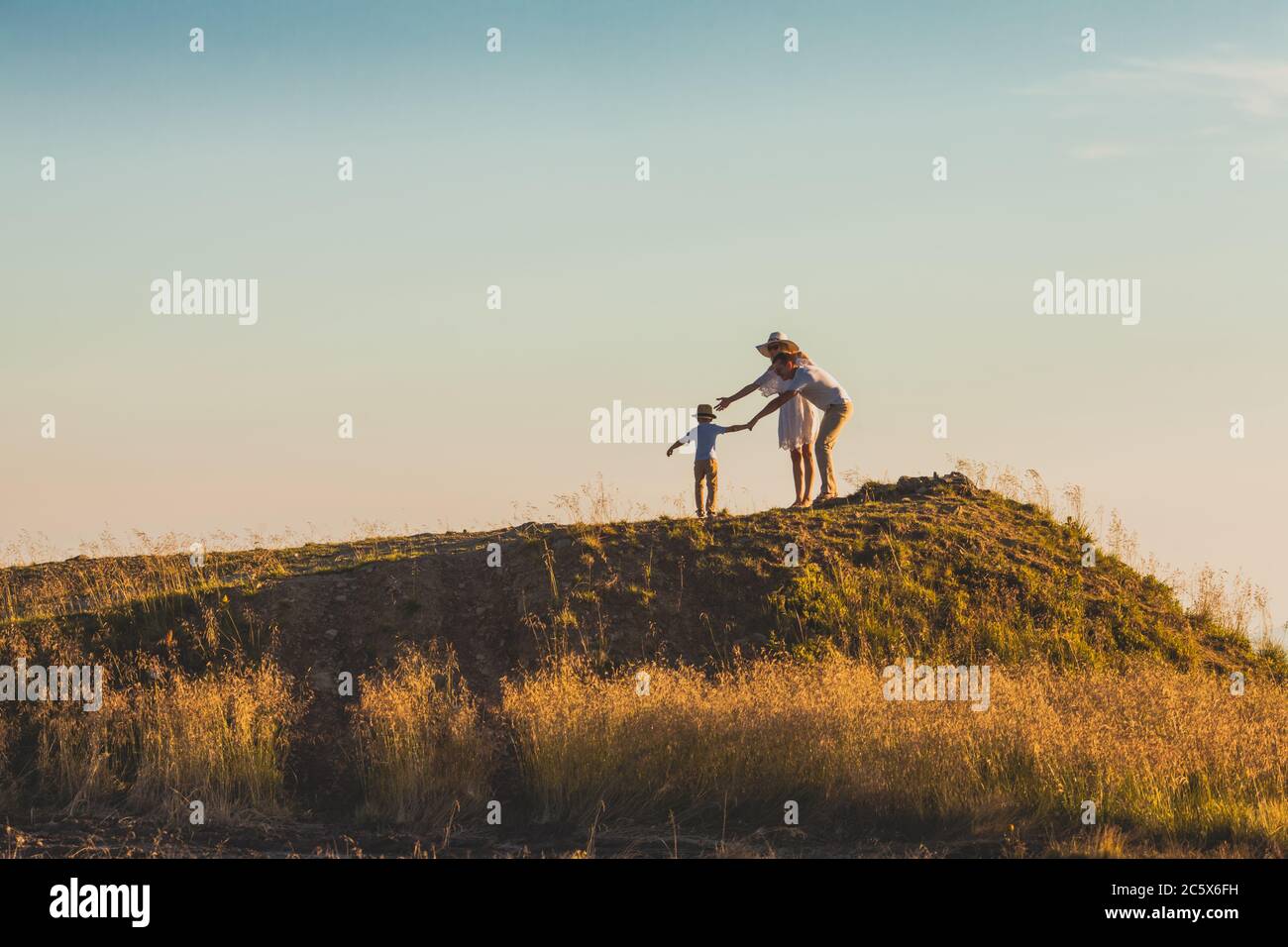 Boy trying to break free from parents Stock Photo - Alamy