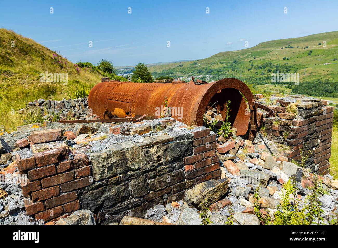 Rusting remains of an old, Victorian era boiler and lifting engine ...