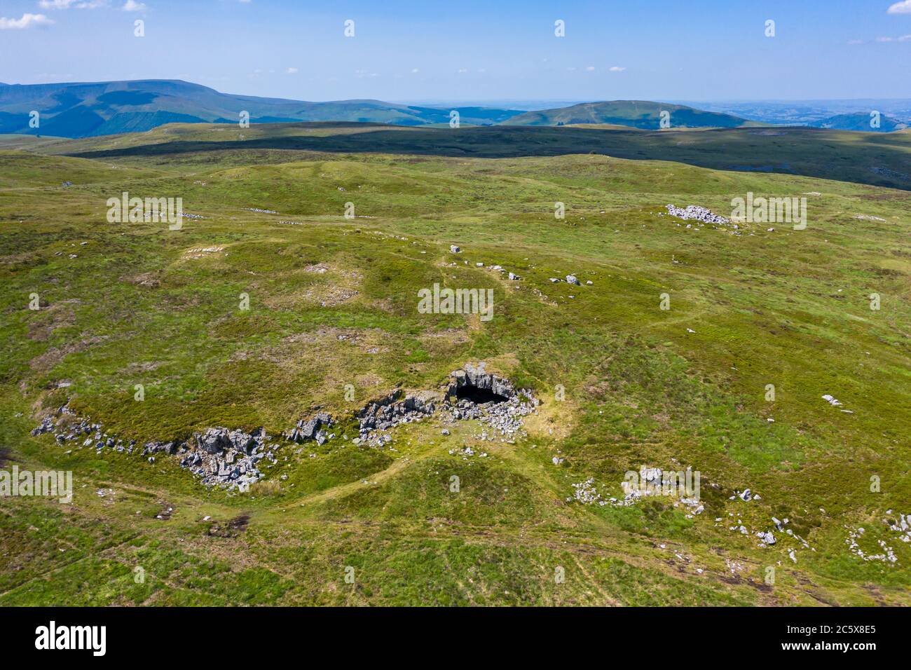 Aerial view of the entrance to an underground cave system on remote ...