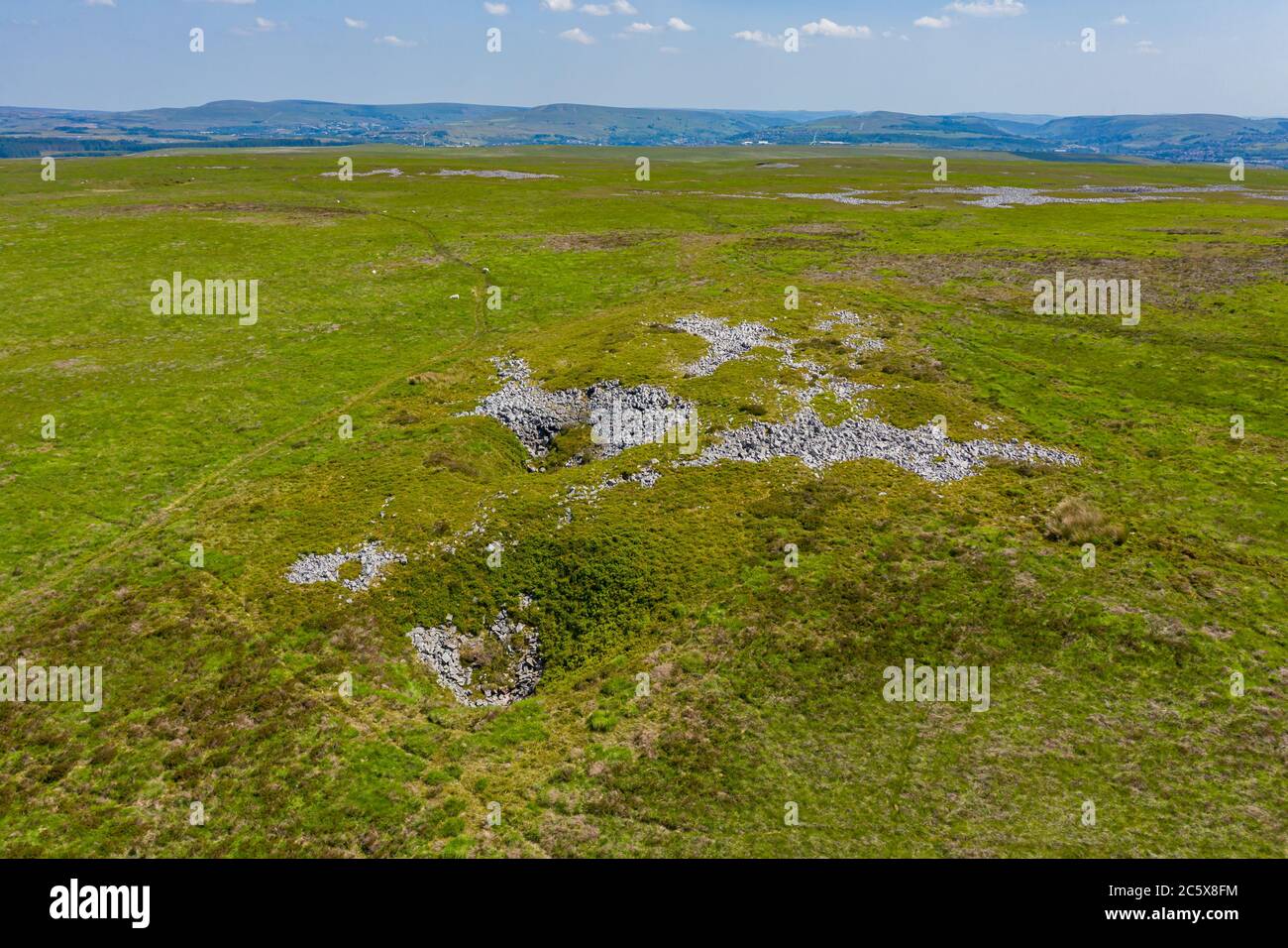 Aerial view of sinkholes and shakeholes from collapsed cave systems on ...