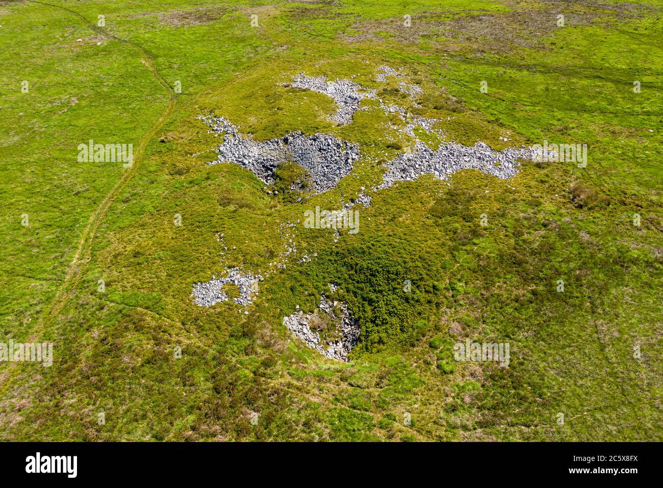 Aerial view of sinkholes and shakeholes from collapsed cave systems on ...