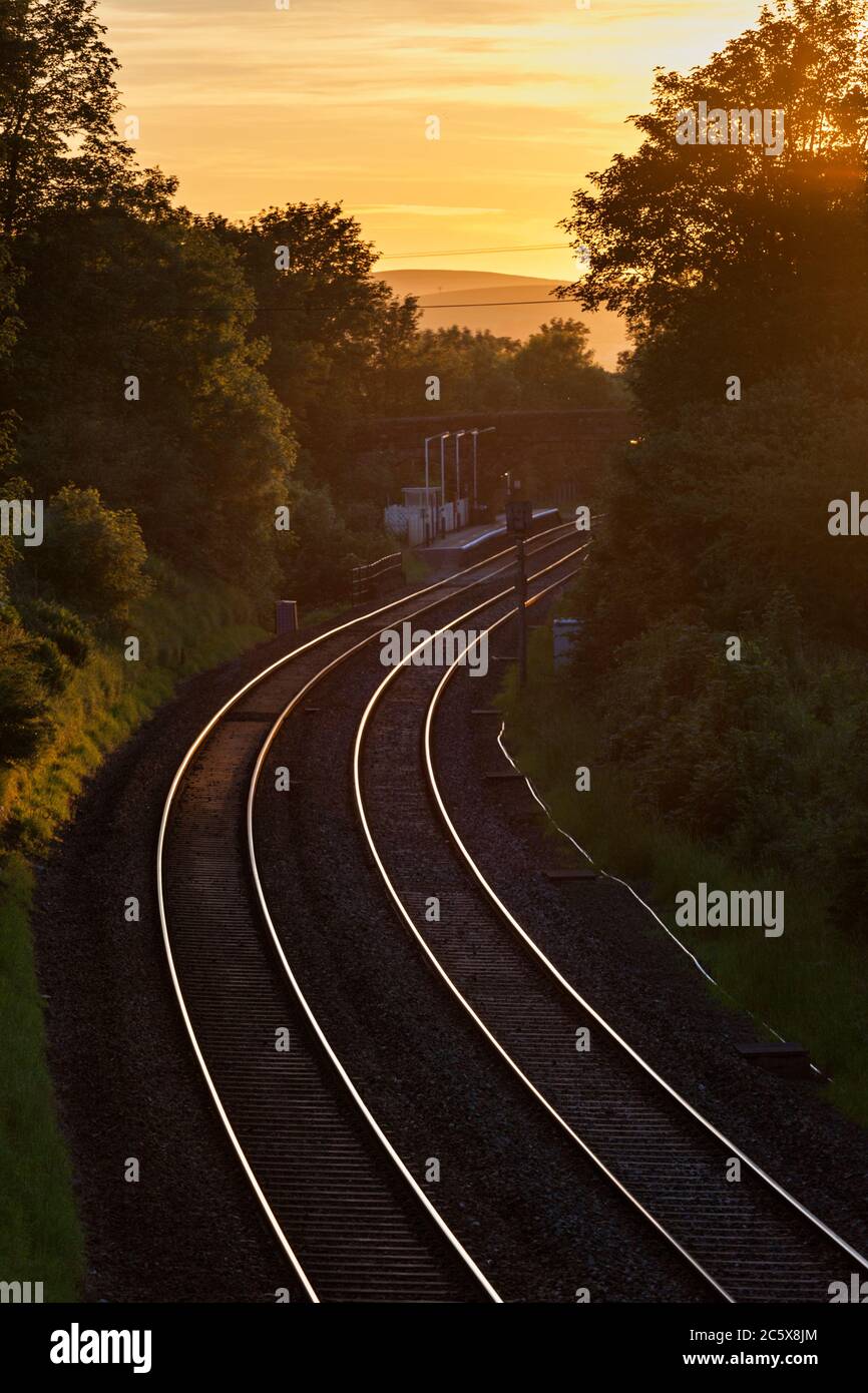 UK Network Rail railway line at sunset curving towards Long Preston ...