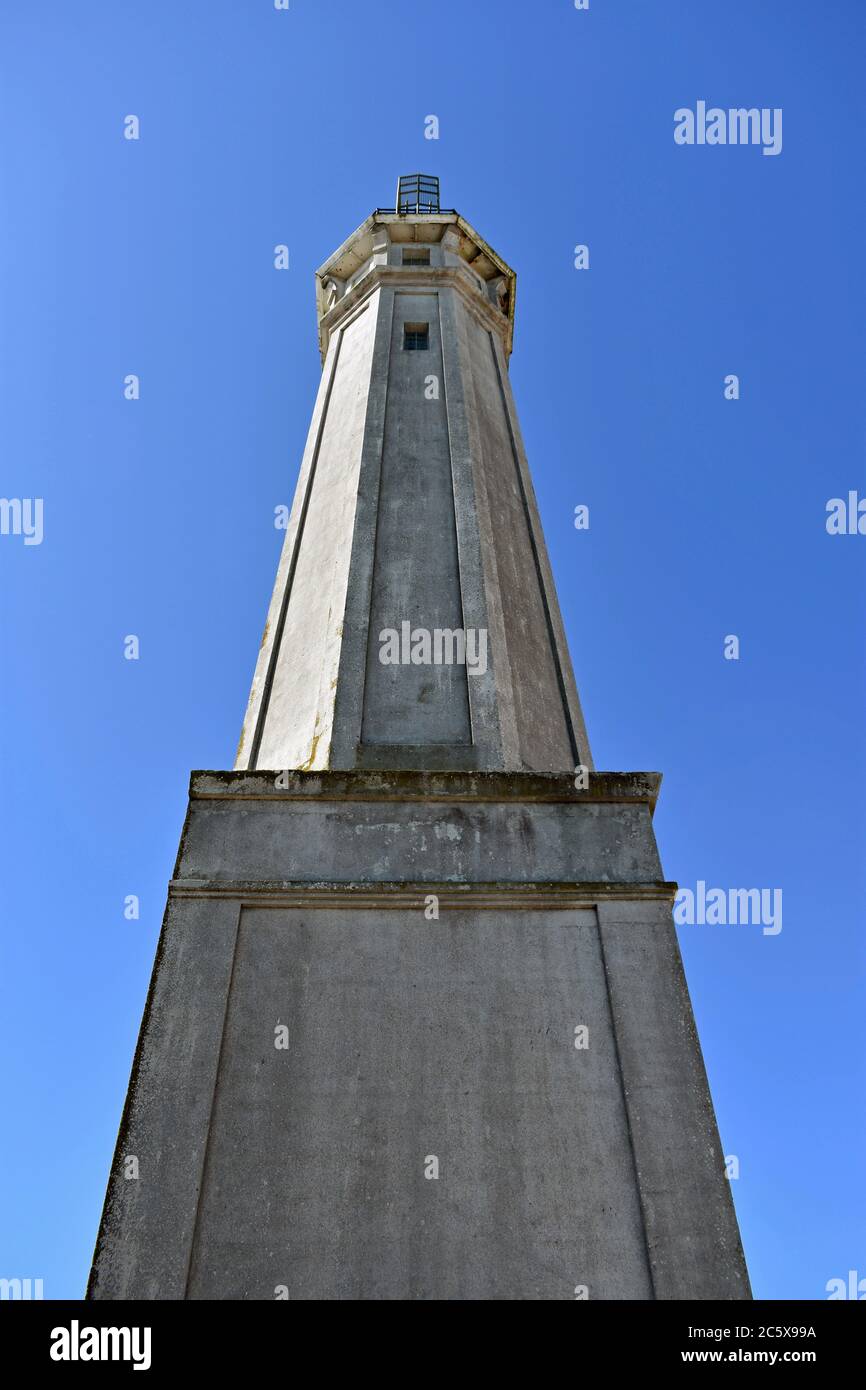 Looking up at the lighthouse on Alcatraz Island with clear blue sky ...