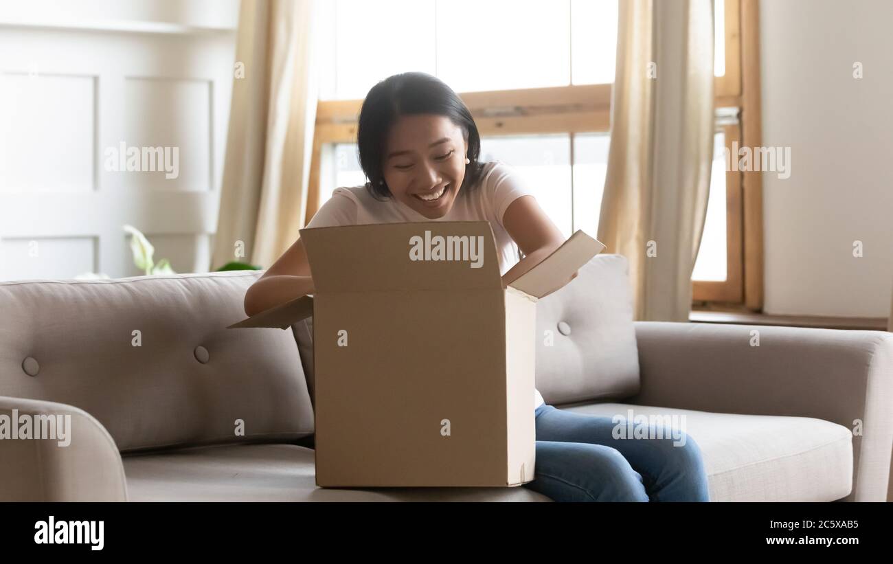 Woman unboxing new order hi-res stock photography and images - Alamy