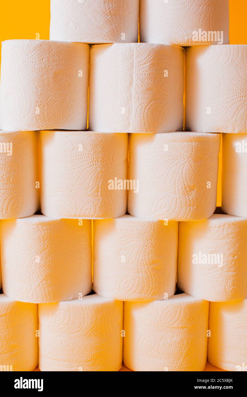 Toilet paper rolls as a wall background pattern Stock Photo - Alamy