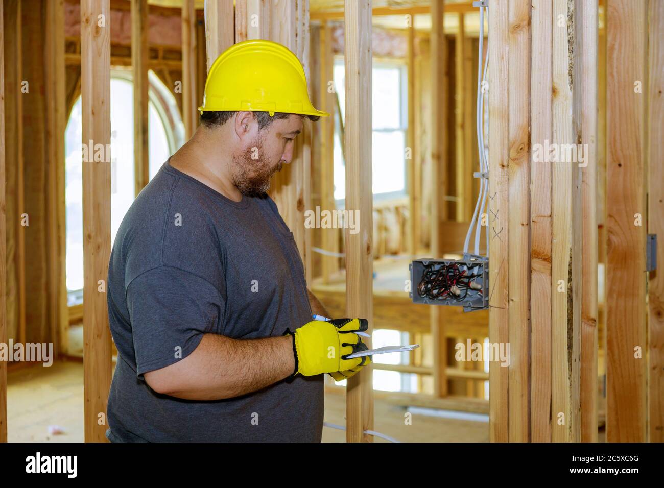 Electrical specialist checking inspects house electrical systems ...