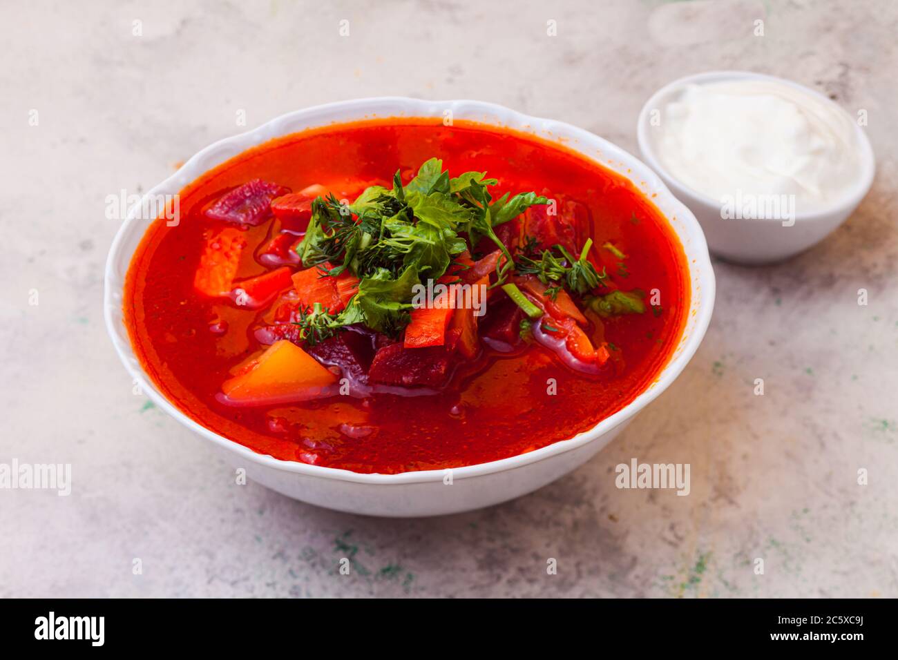 Delicious red borsch with herbs and sour cream Stock Photo - Alamy