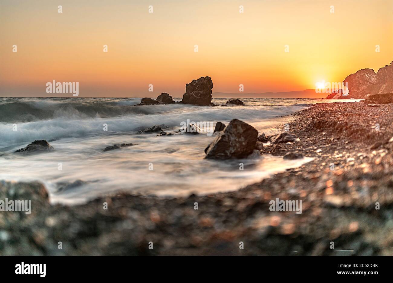 Photographing the waves that hit the rocks in a stormy weather with a ...
