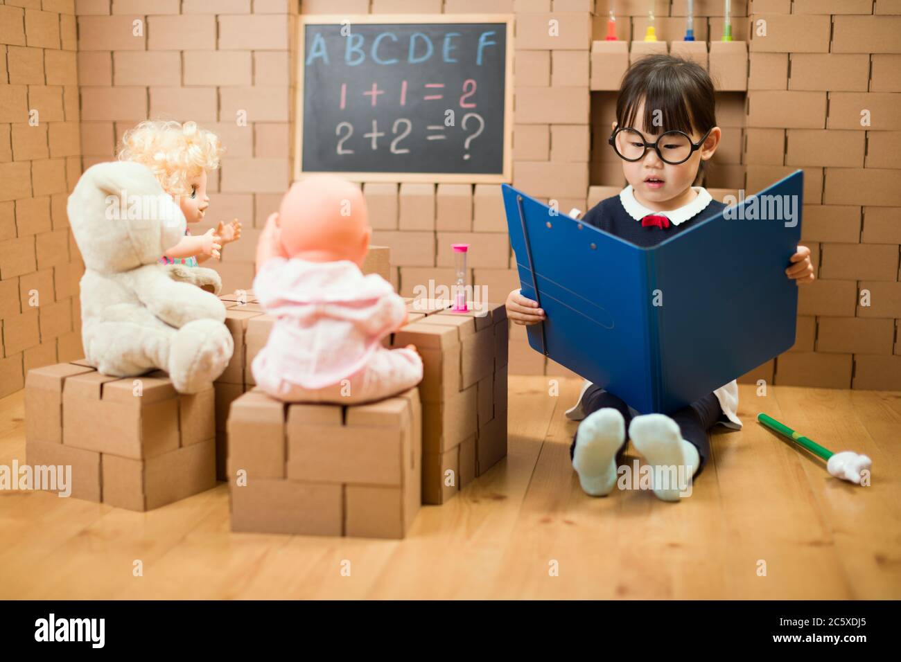 Child pretending to be teacher hi-res stock photography and images - Alamy