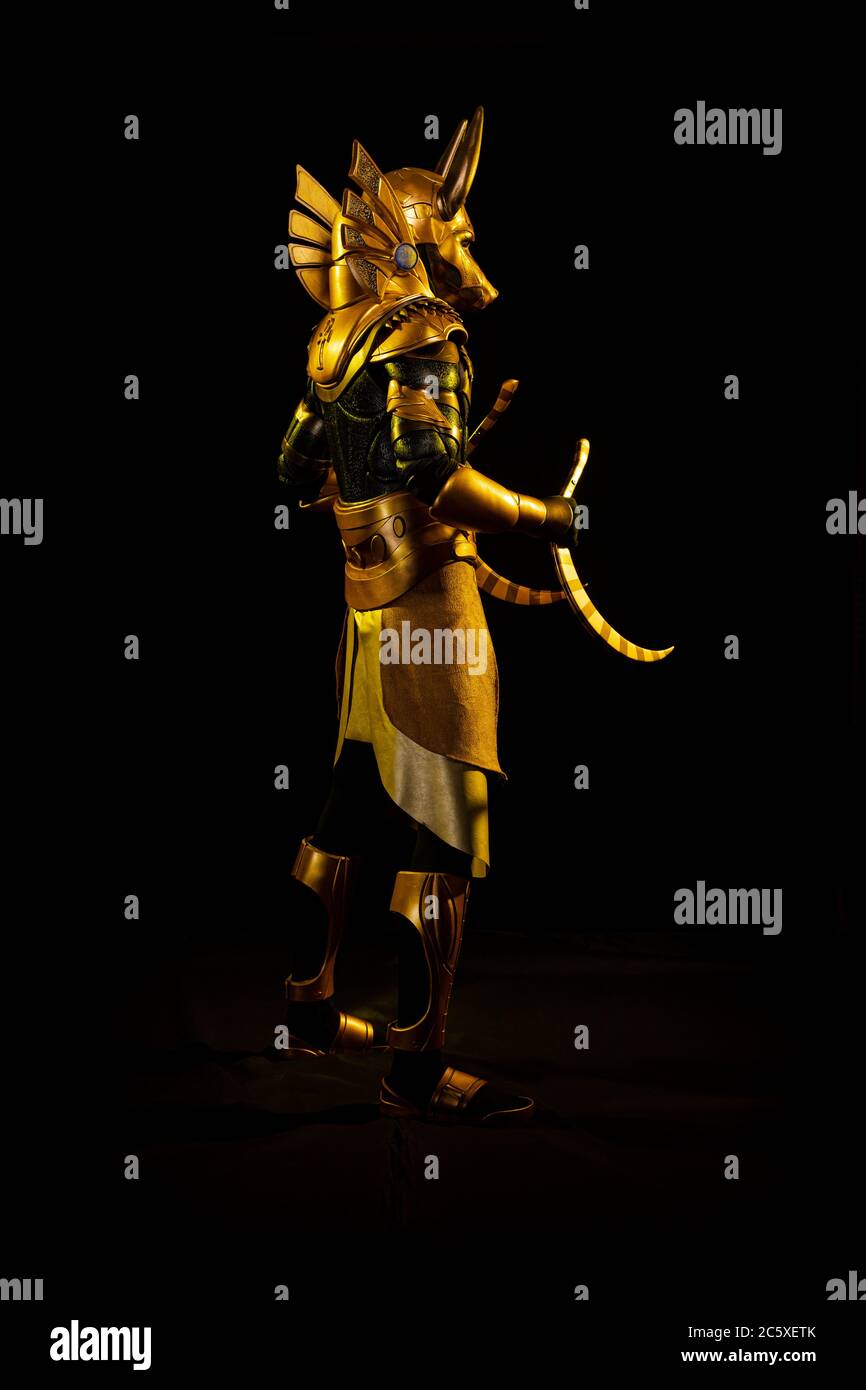 a male actor in a suit of an Egyptian mythology character, the golden ...