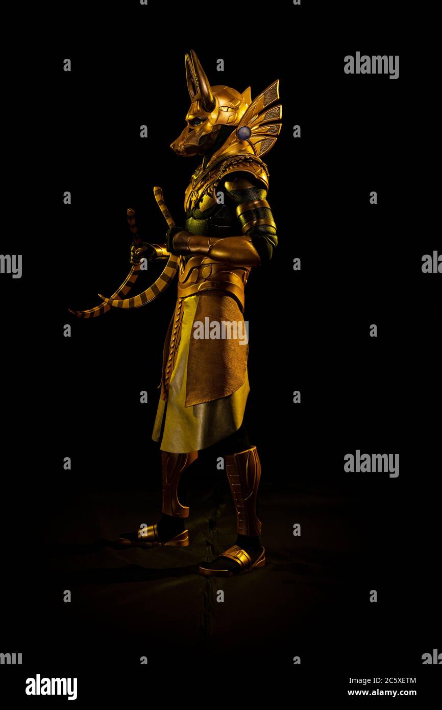 a male actor in a suit of an Egyptian mythology character, the golden ...