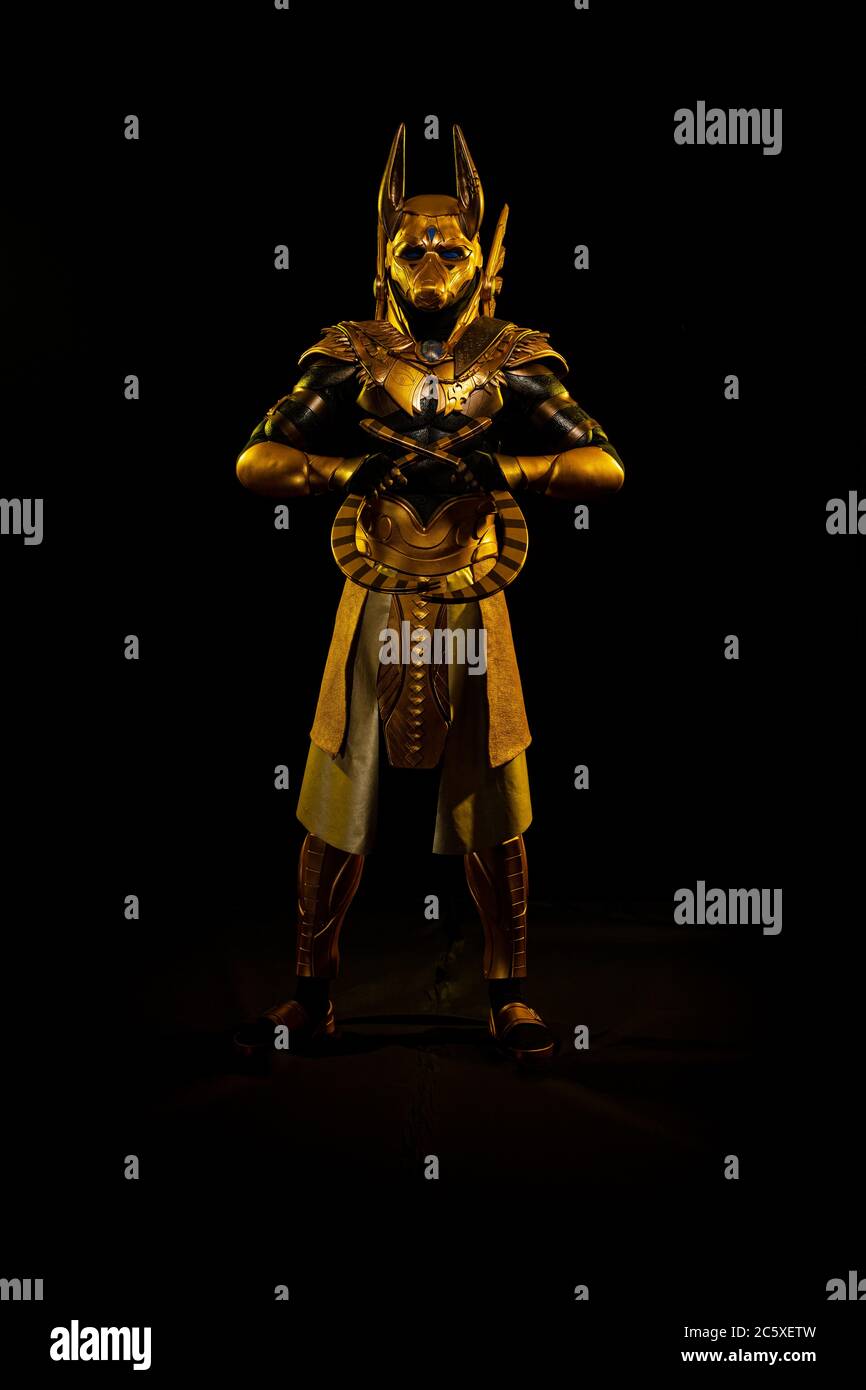 a male actor in a suit of an Egyptian mythology character, the golden ...