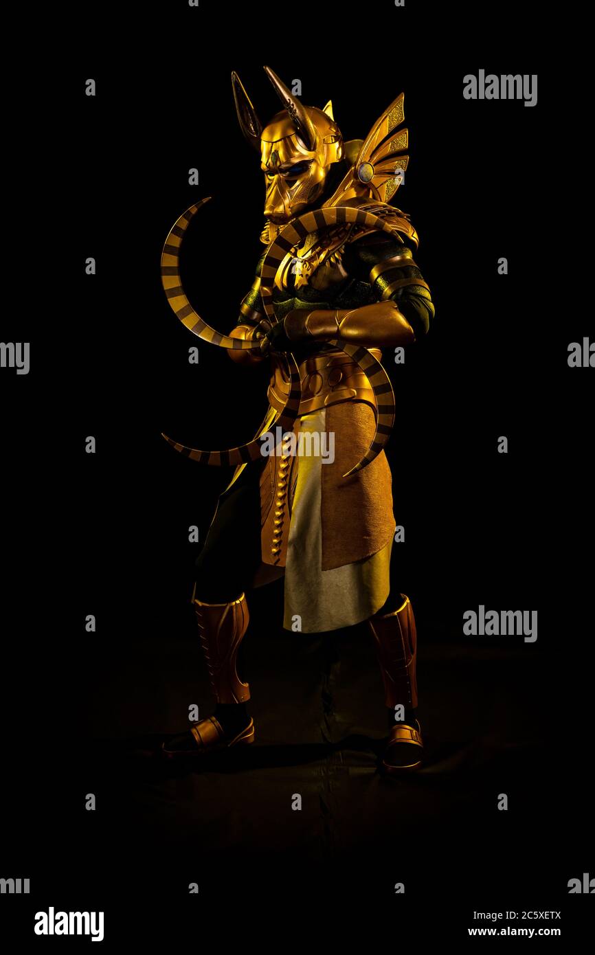 a male actor in a suit of an Egyptian mythology character, the golden ...