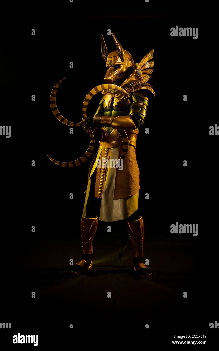 a male actor in a suit of an Egyptian mythology character, the golden ...