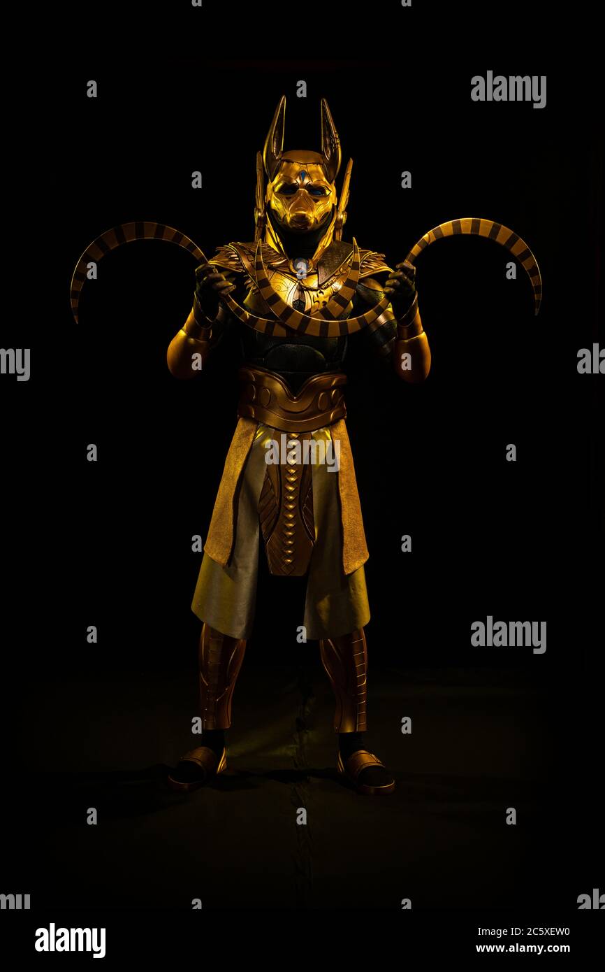 a male actor in a suit of an Egyptian mythology character, the golden ...