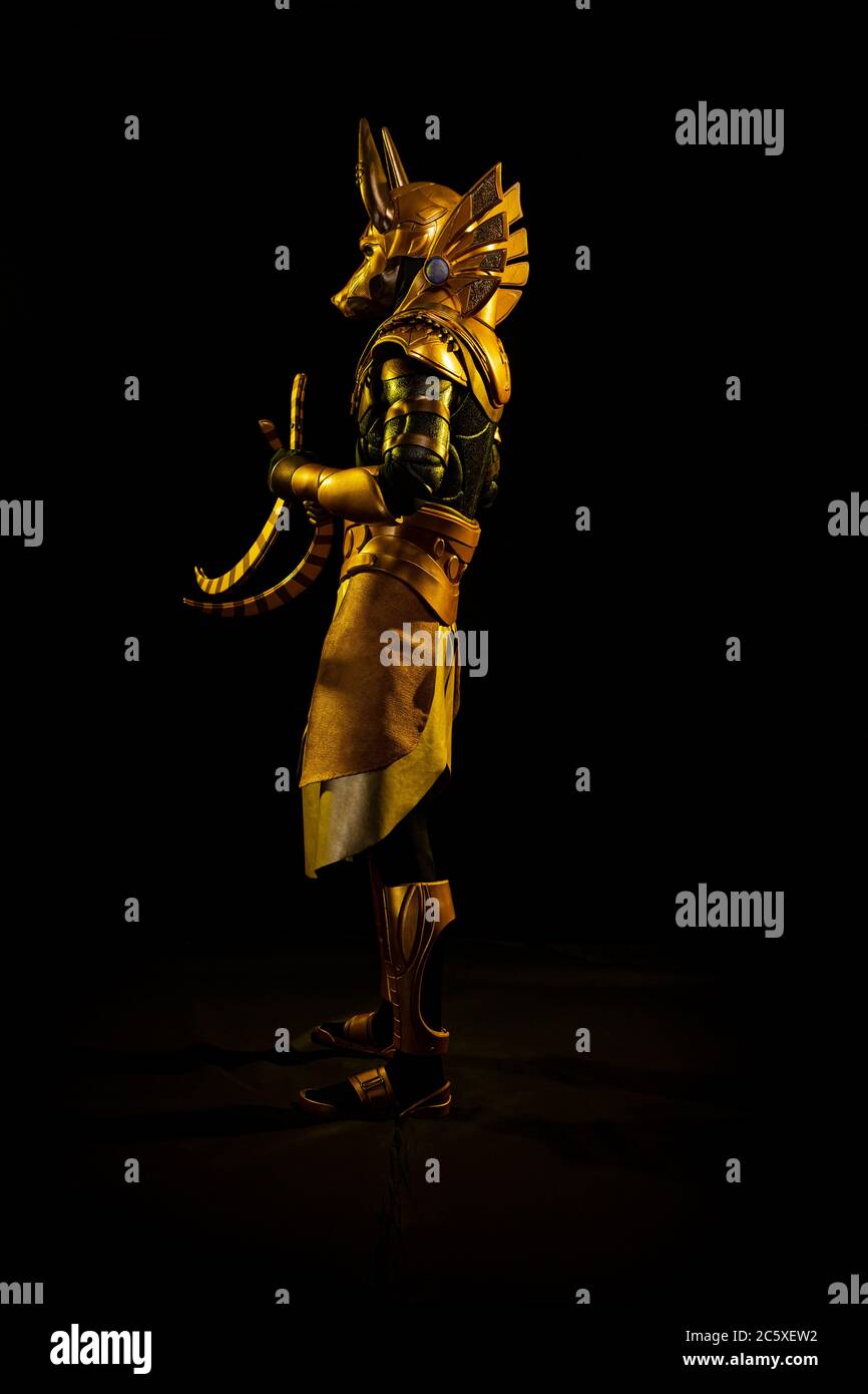a male actor in a suit of an Egyptian mythology character, the golden ...