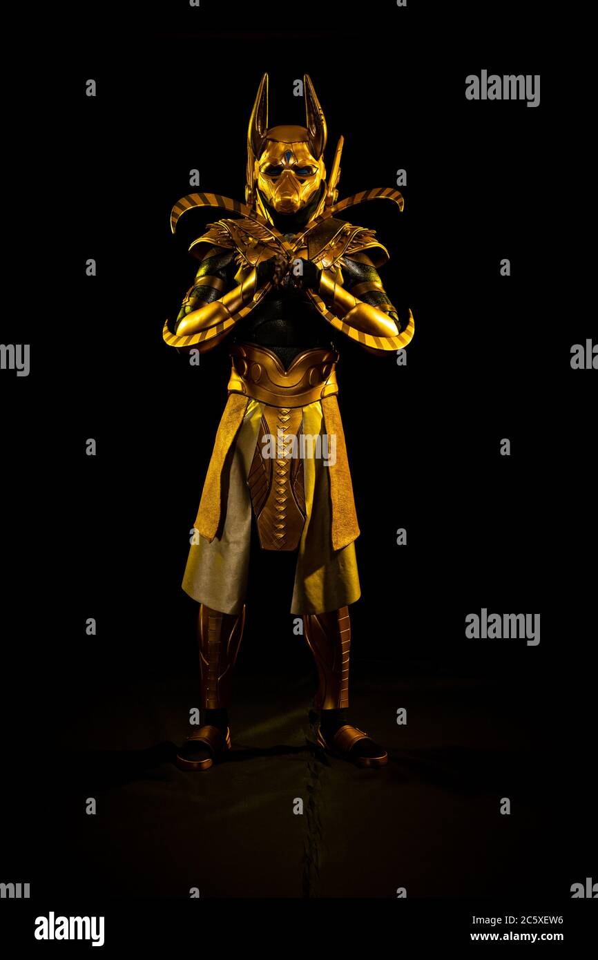 a male actor in a suit of an Egyptian mythology character, the golden ...
