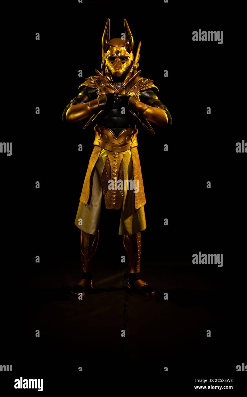 a male actor in a suit of an Egyptian mythology character, the golden ...