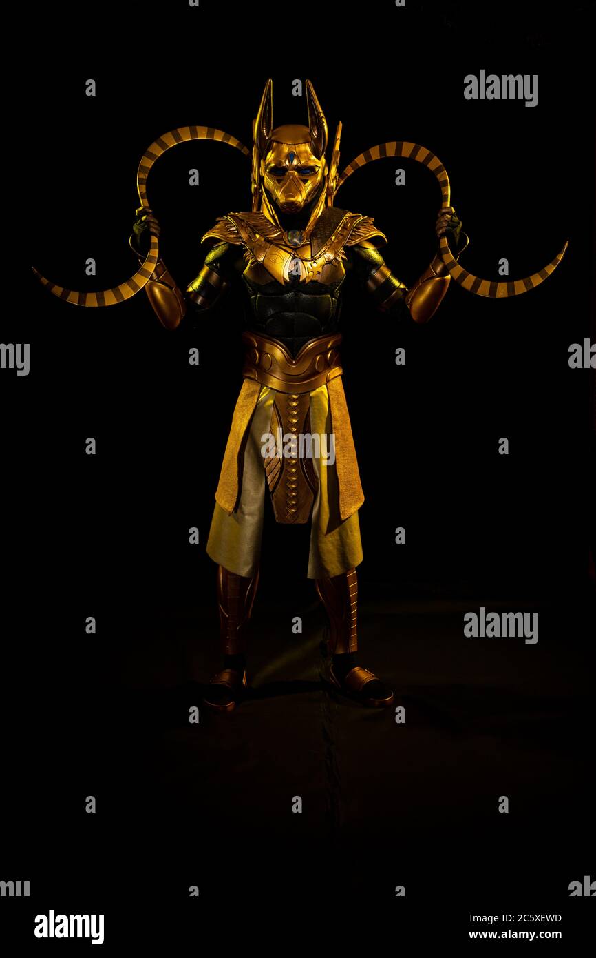 a male actor in a suit of an Egyptian mythology character, the golden ...