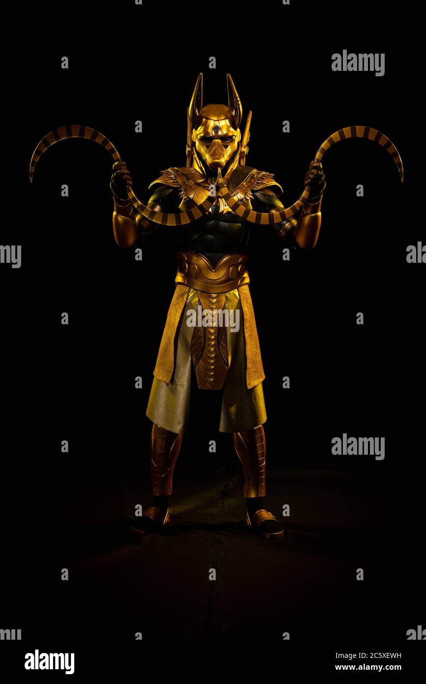 a male actor in a suit of an Egyptian mythology character, the golden ...