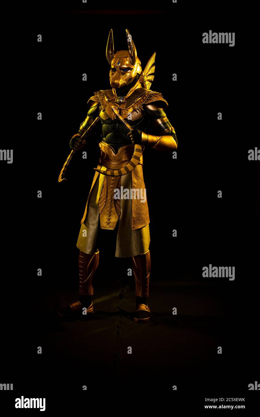 a male actor in a suit of an Egyptian mythology character, the golden ...